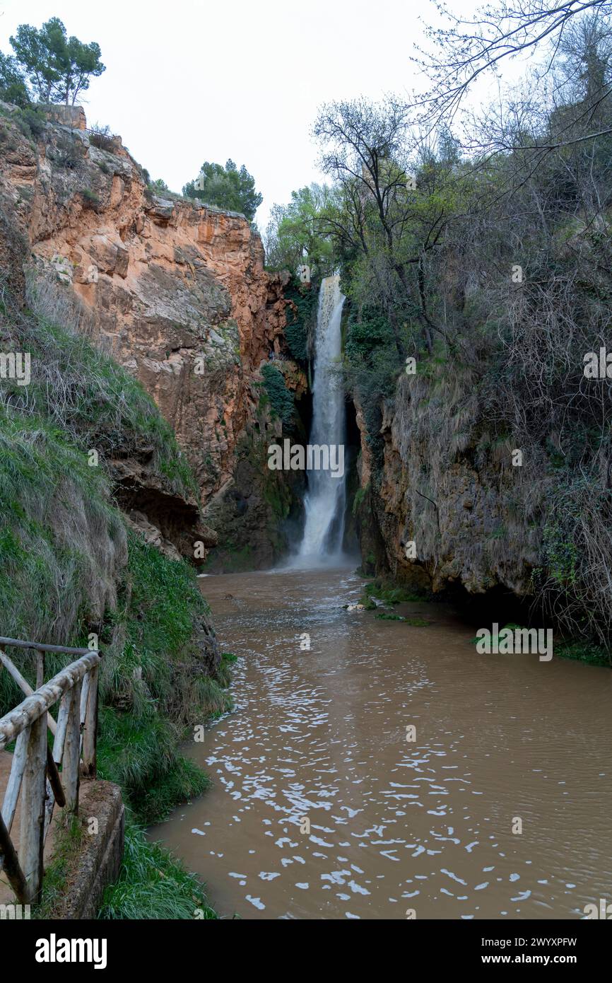 Lush greenery frames the powerful cascade at Monasterio de Piedra, a ...