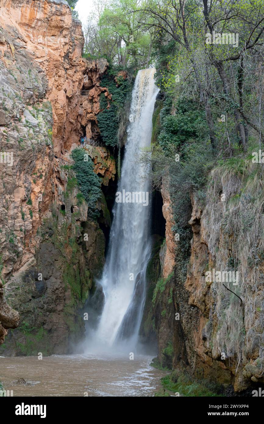 Lush greenery frames the powerful cascade at Monasterio de Piedra, a ...