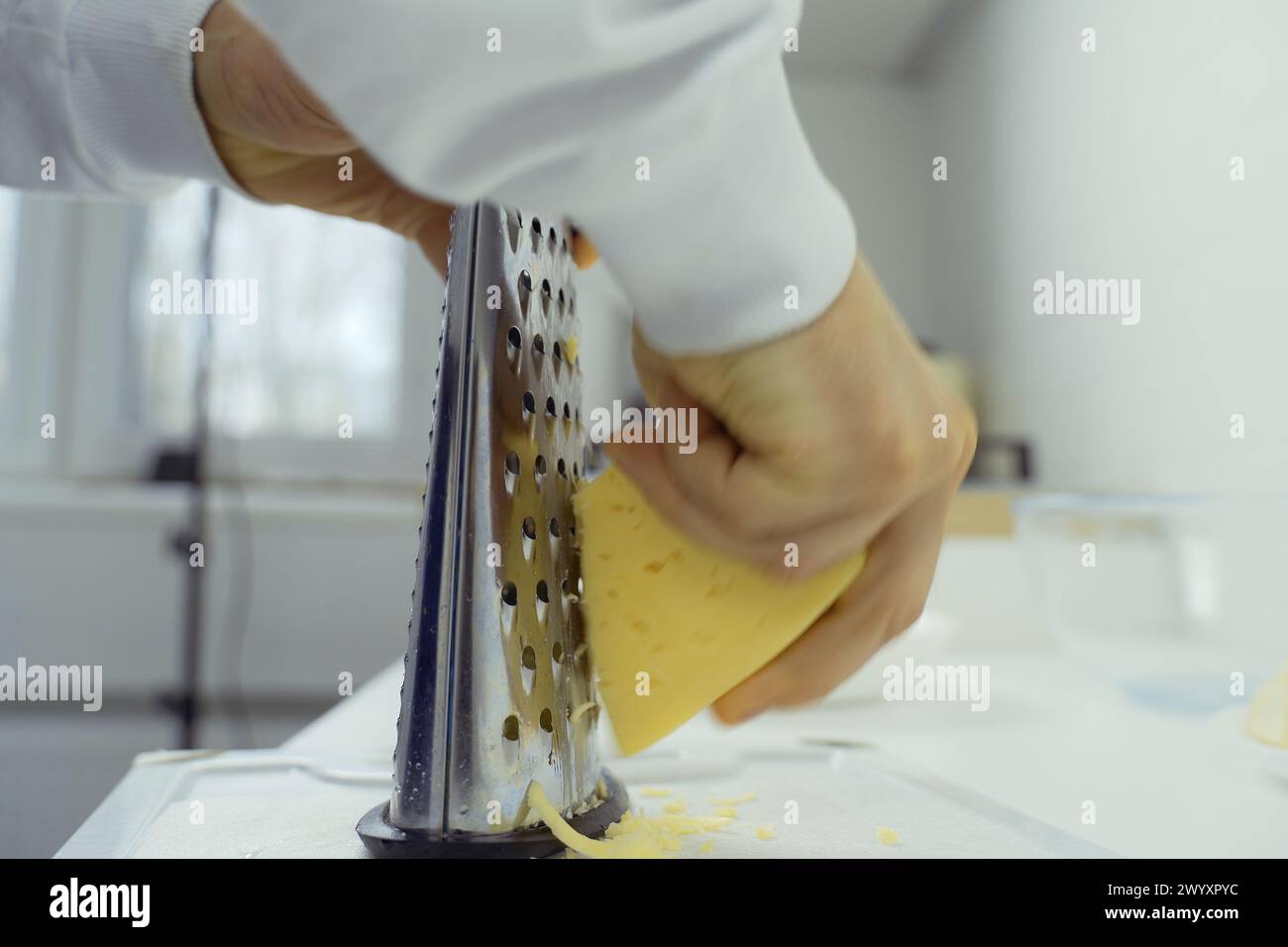 Grating cheese hi-res stock photography and images - Alamy