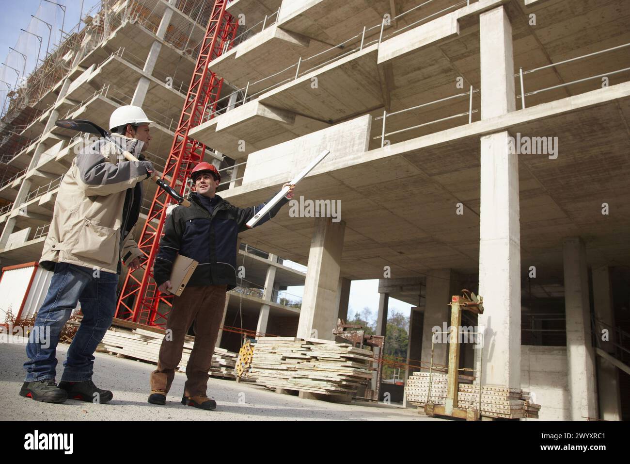Architect and construction worker, personal protective equipment ...