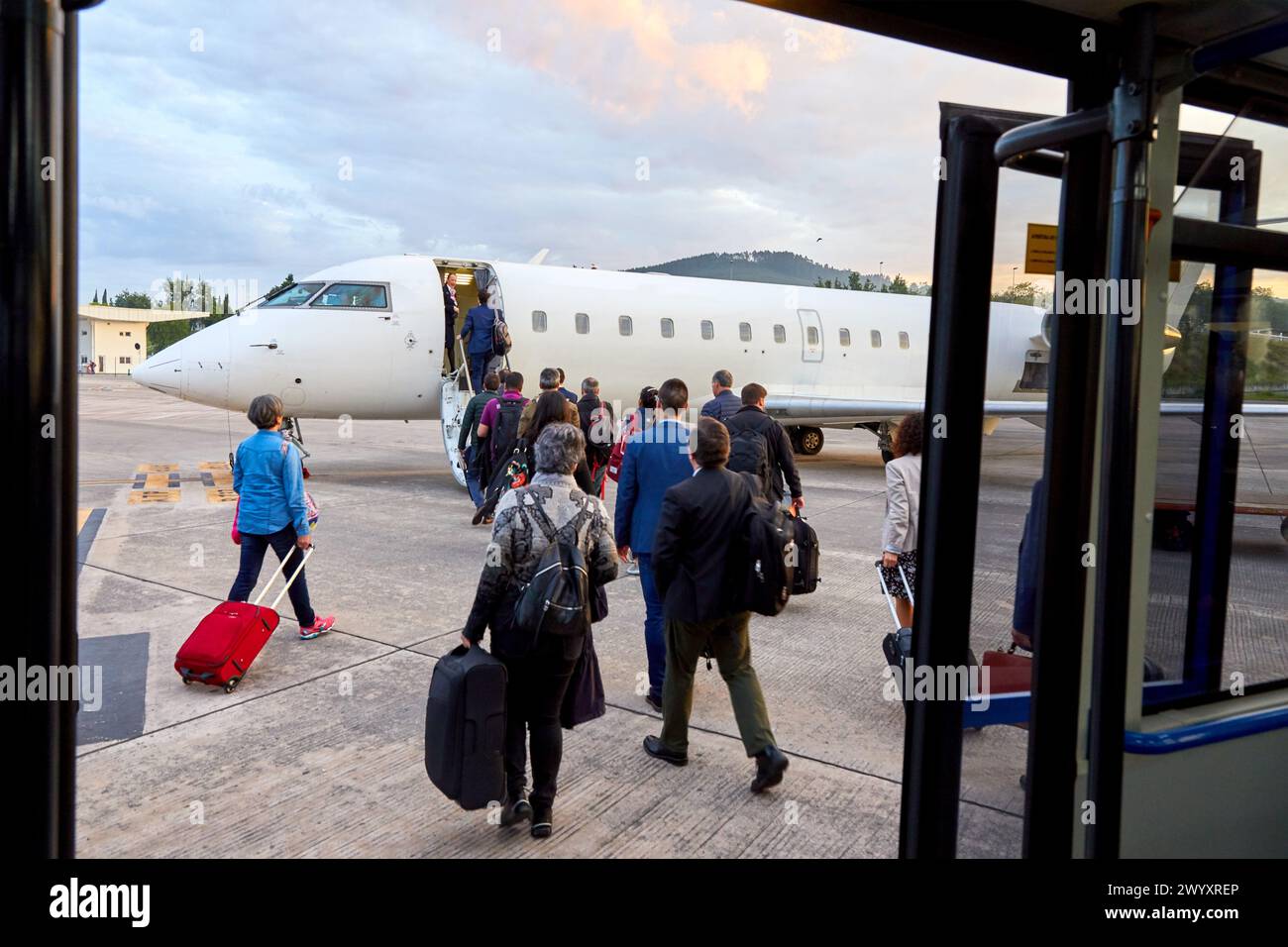 Passengers leaving the bus on the way to the plane, Bilbao Airport ...