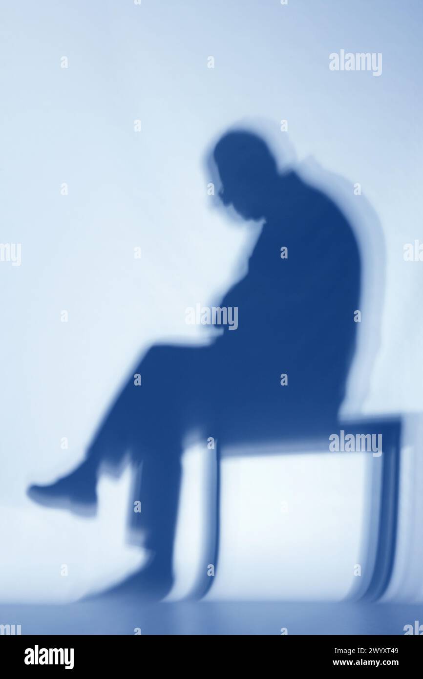 Shadow, elderly man sitting, retired Stock Photo - Alamy