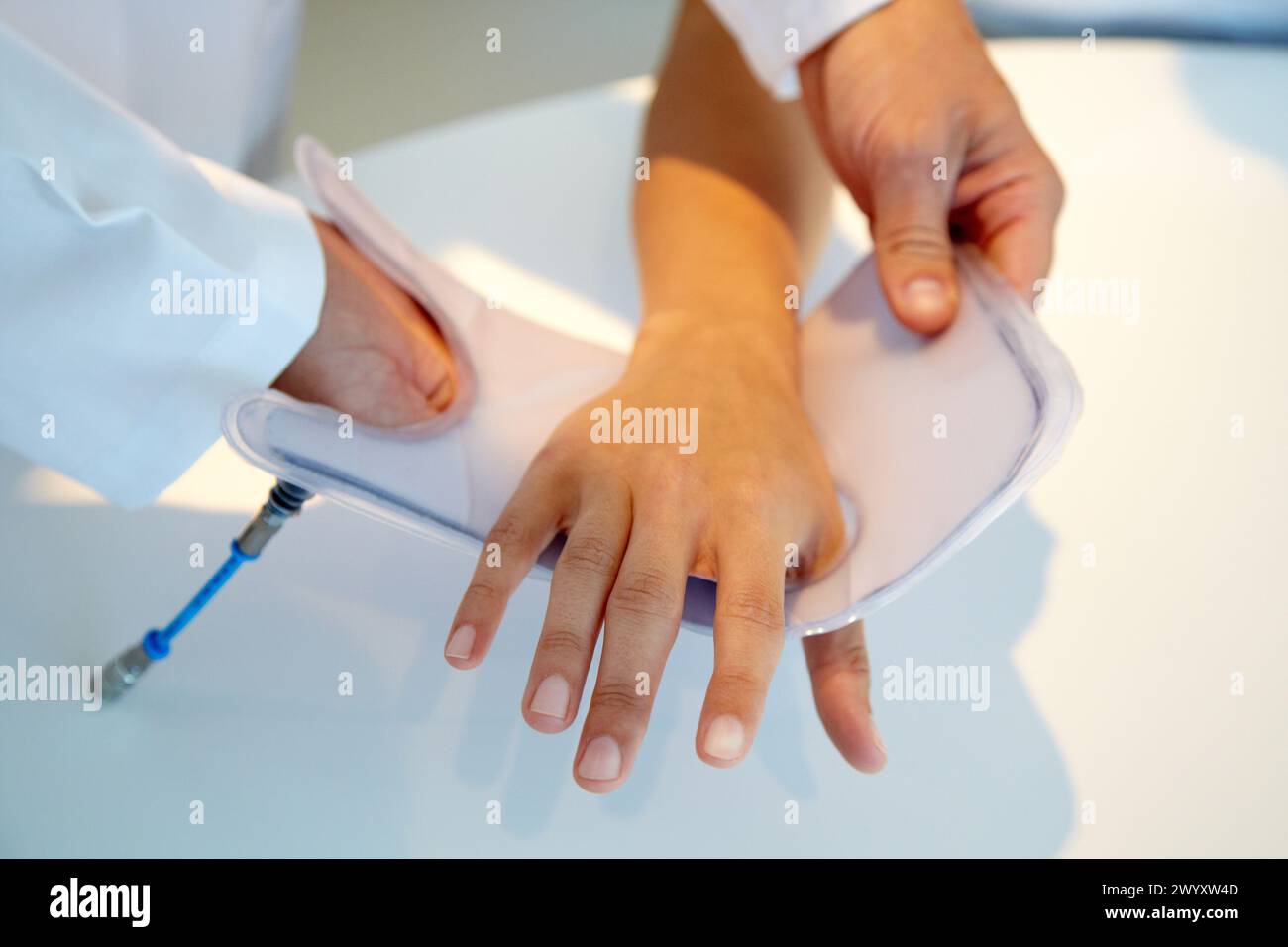 Researcher placing a patient splint prototype built with variable ...