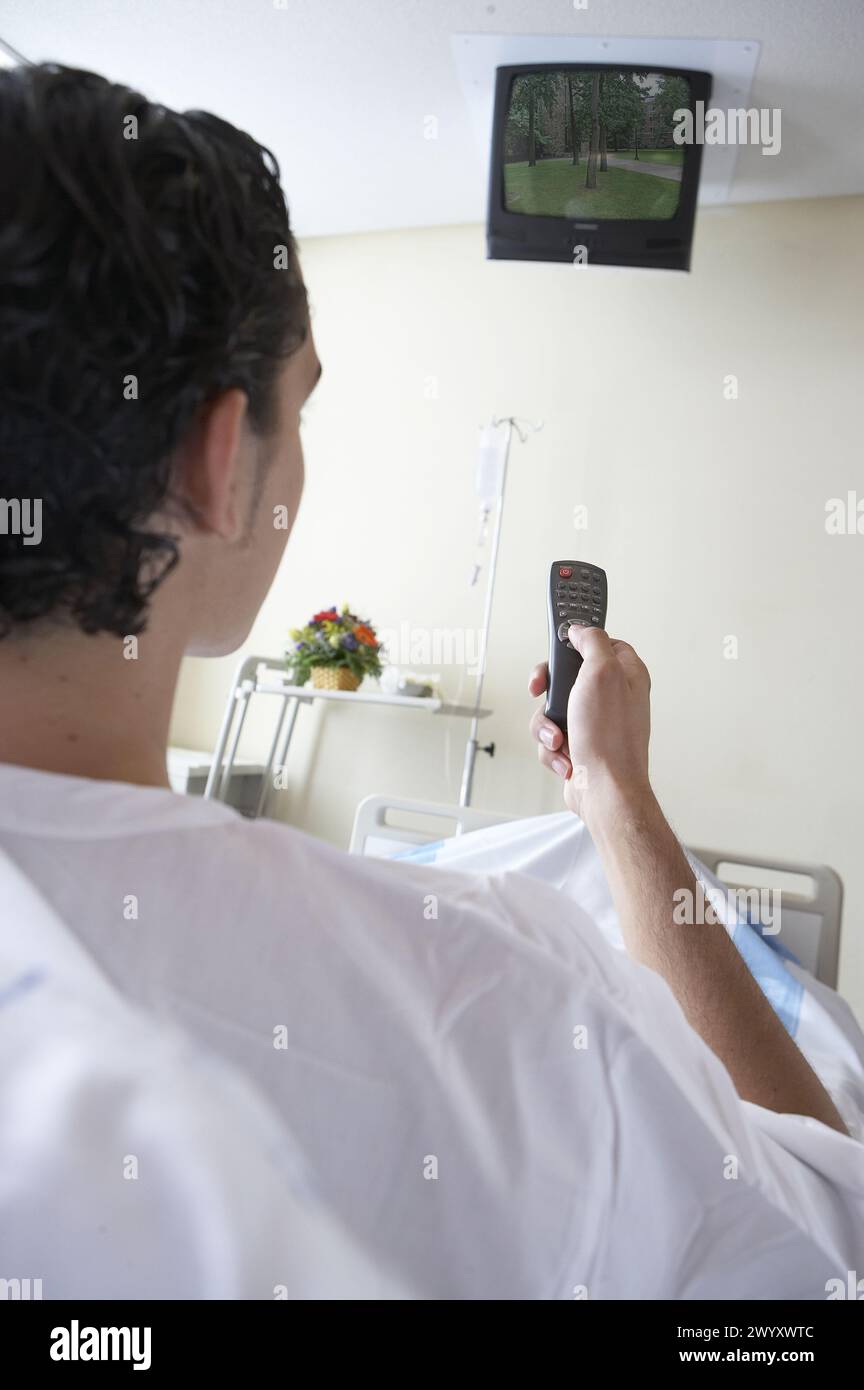 Hospital patient watching tv in bed hi-res stock photography and images ...