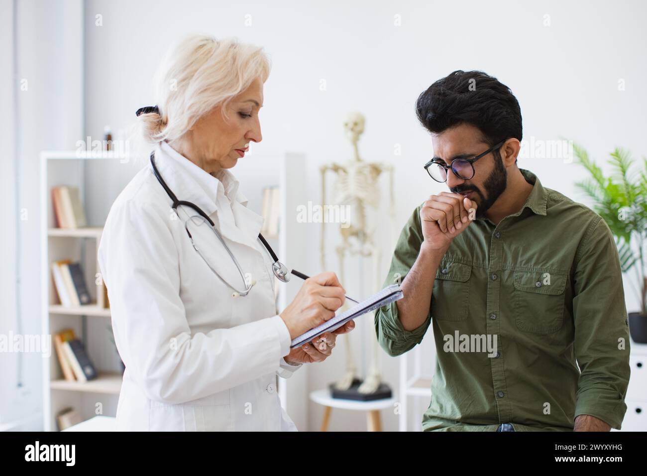 Elder specialist writing instruction for taking medication correctly ...