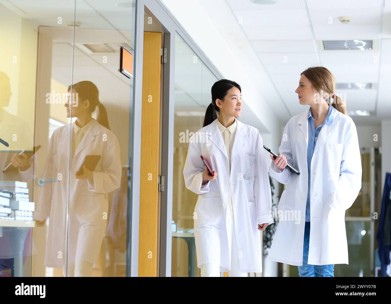 Researchers walking in hallway laboratory. Chemical Analysis Laboratory ...