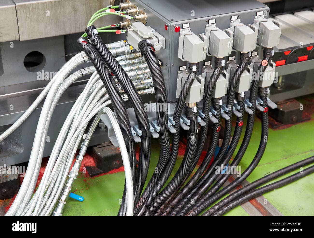Machining center. Electrical and pressure hoses Stock Photo - Alamy