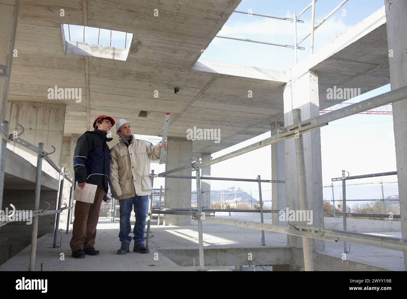 Architect and construction worker, personal protective equipment ...