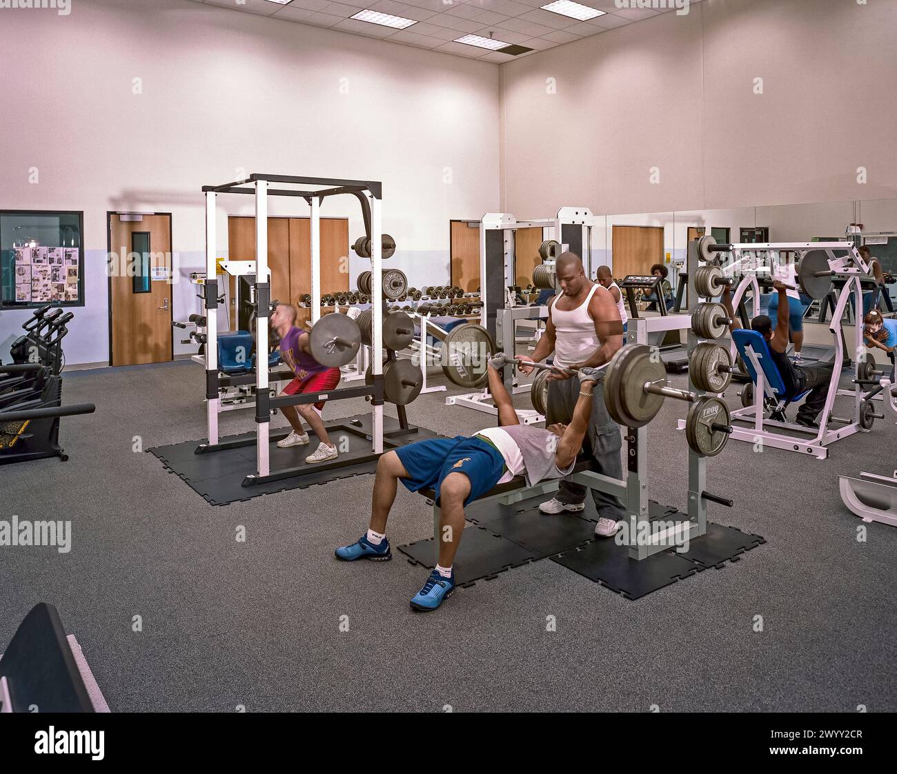 Minority students use the weight and exercise facilities in a college ...