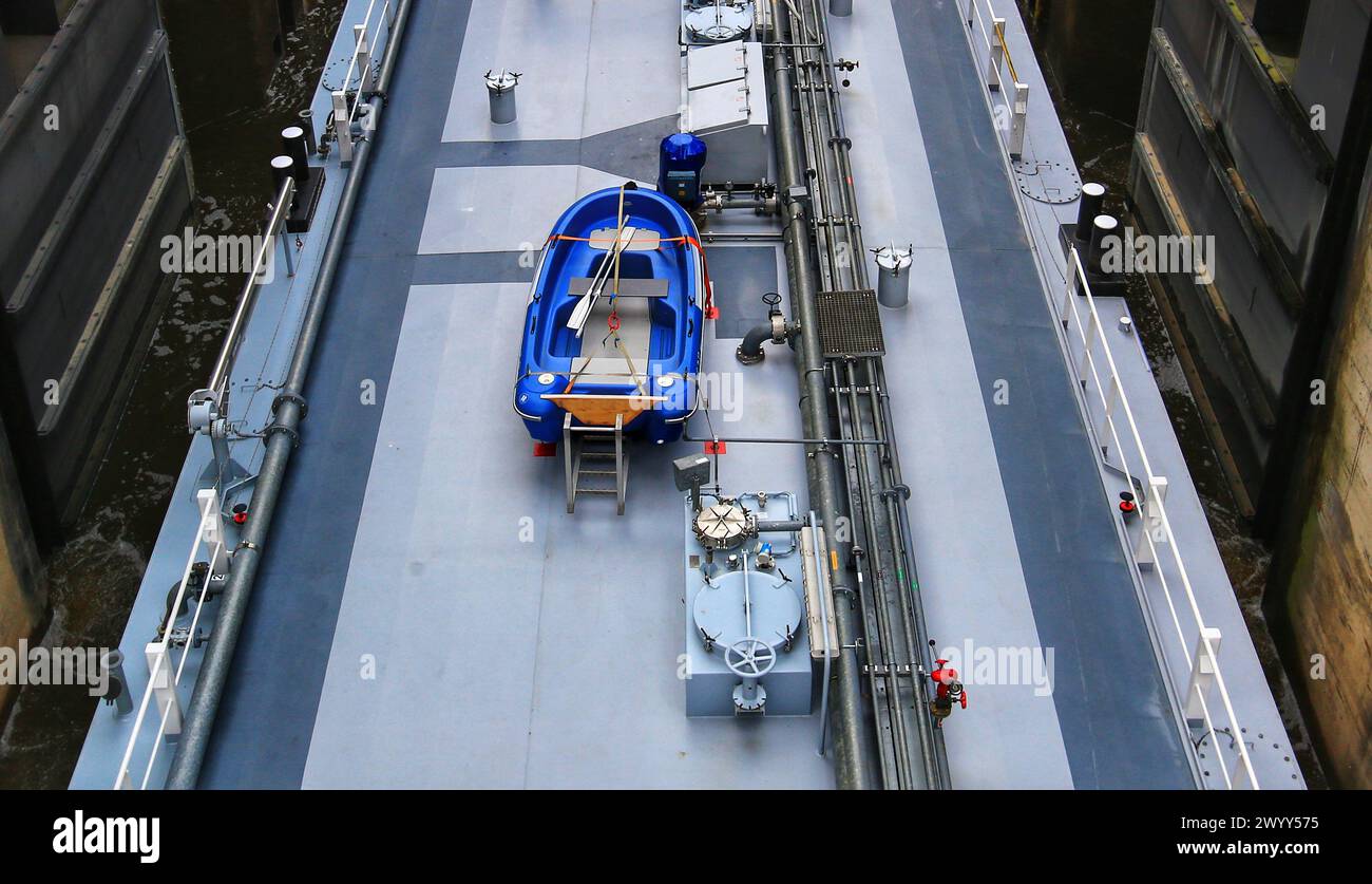 View on deck of inland barge with pipes and boat Stock Photo - Alamy
