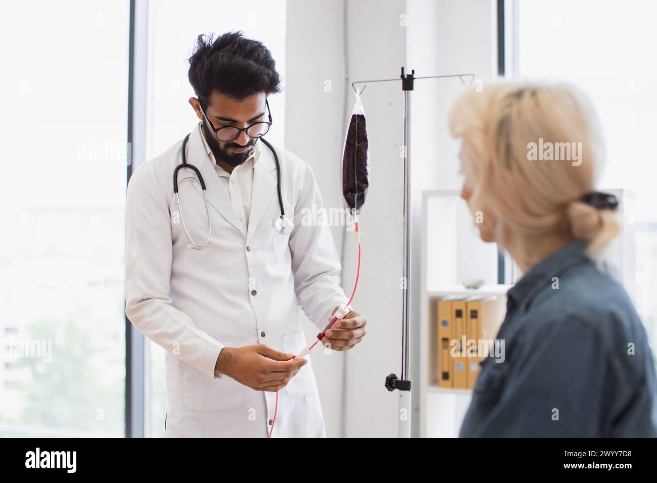 Medical specialist checking system before procedure of patient in exam ...