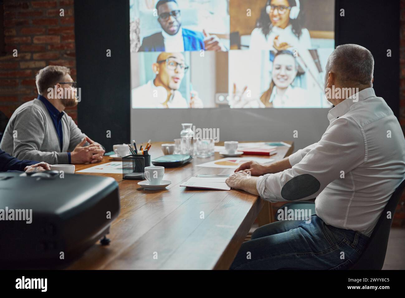 Cooperation with trainees. Businessmen, team leaders having online ...