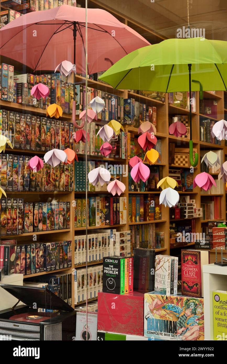 Bookstore window display arranged with umbrellas and origami paper ...