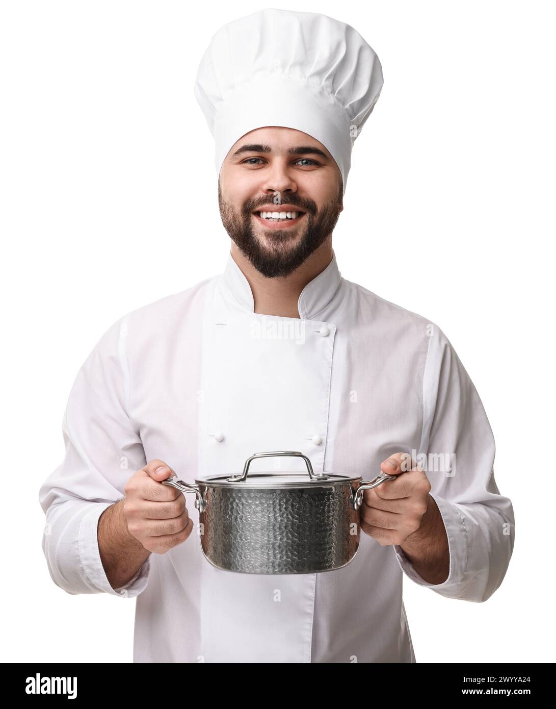 Happy young chef in uniform holding cooking pot on white background ...