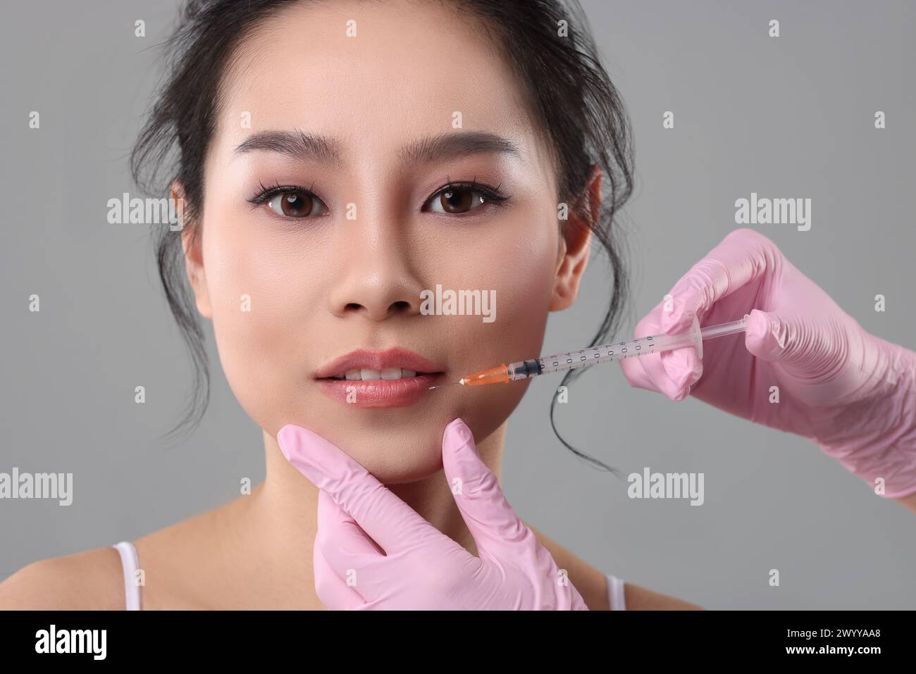 Hands on lip hi-res stock photography and images - Alamy