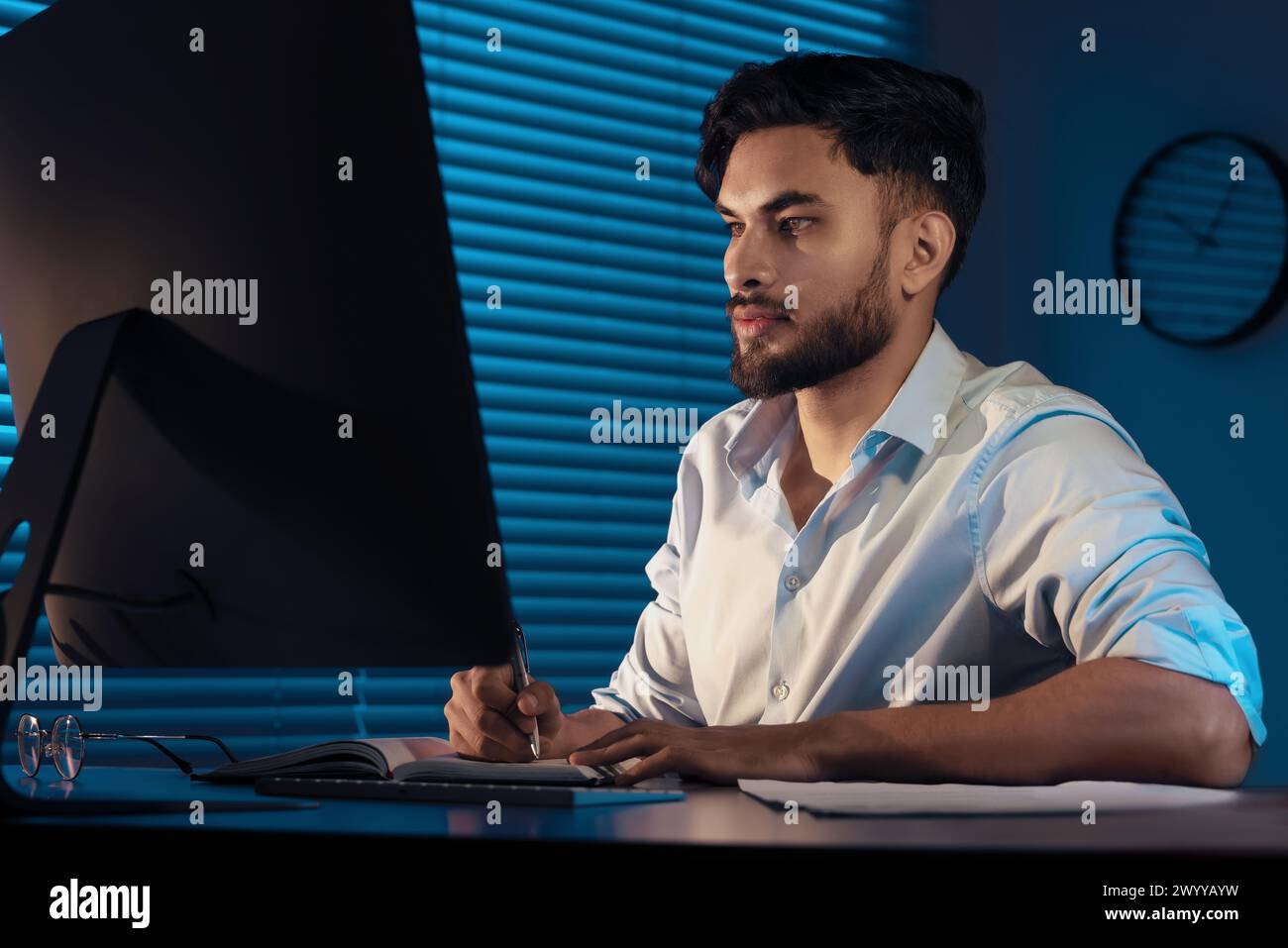 Indian guy working at night hi-res stock photography and images - Alamy