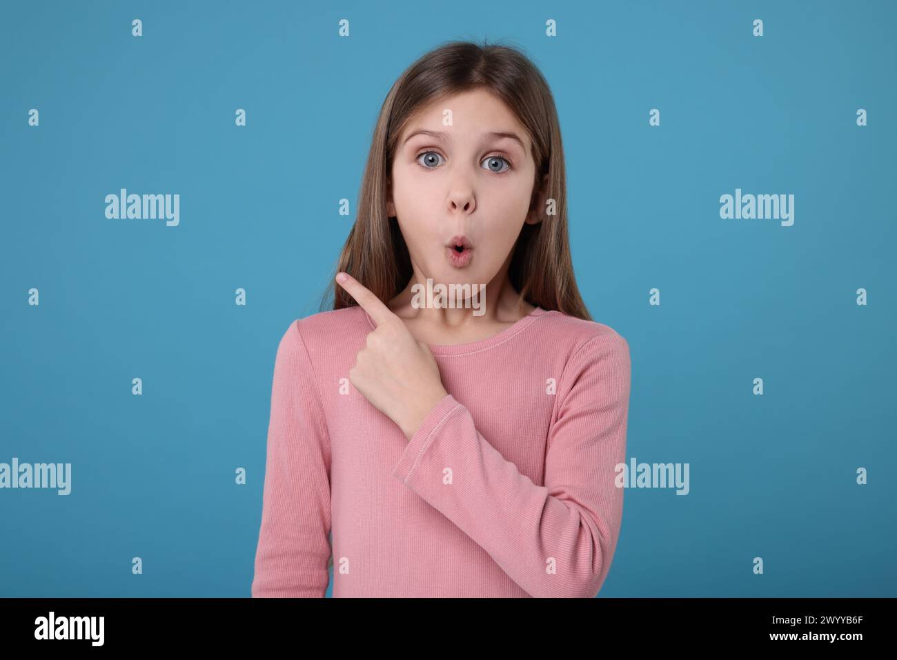 Surprised girl pointing on face hi-res stock photography and images - Alamy