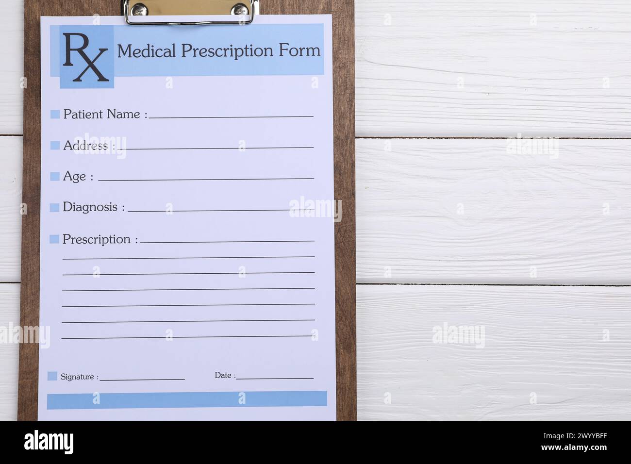 Medical prescription form with empty fields on white wooden table, top ...