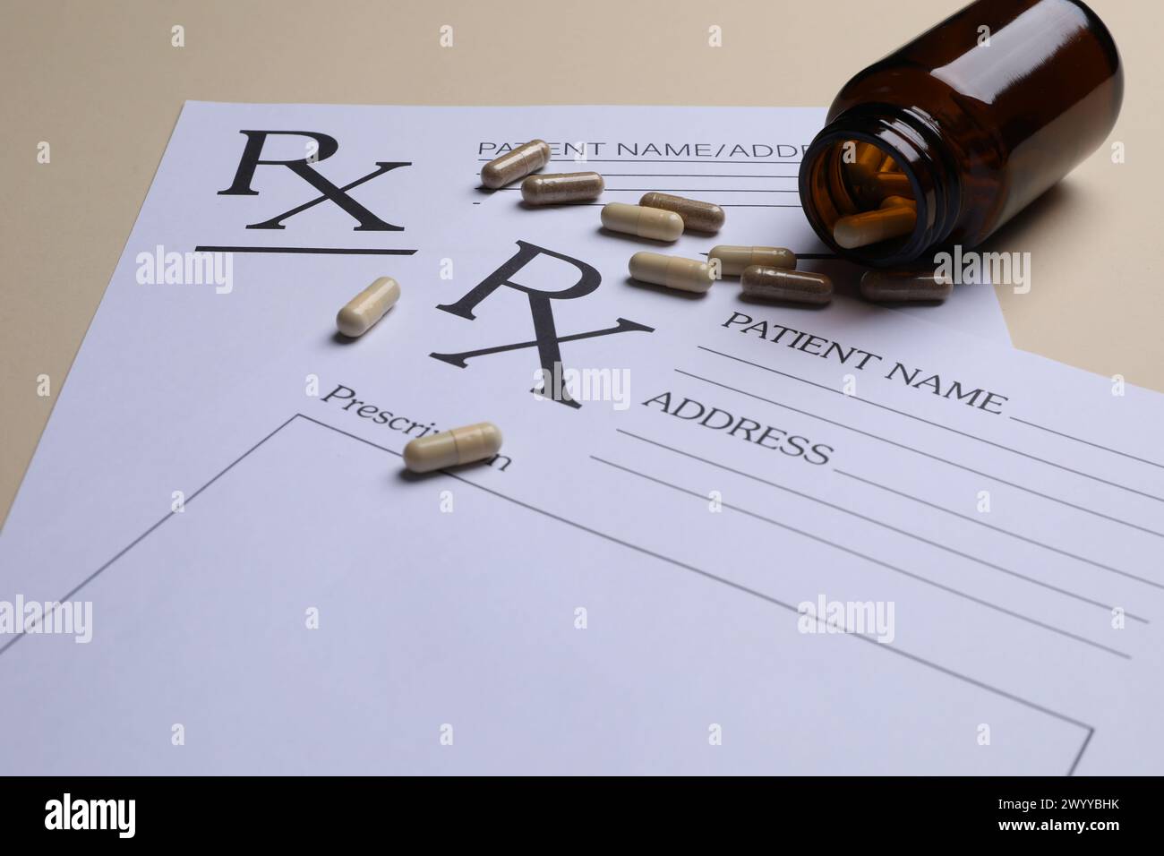 Medical prescription forms, pills and bottle on beige background ...