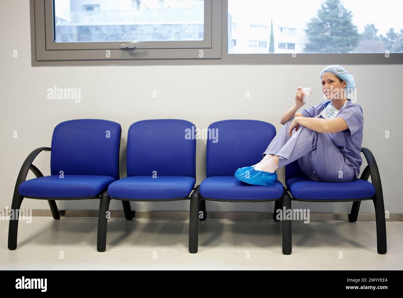 Surgeon taking a coffee in break room, surgical block. Hospital ...