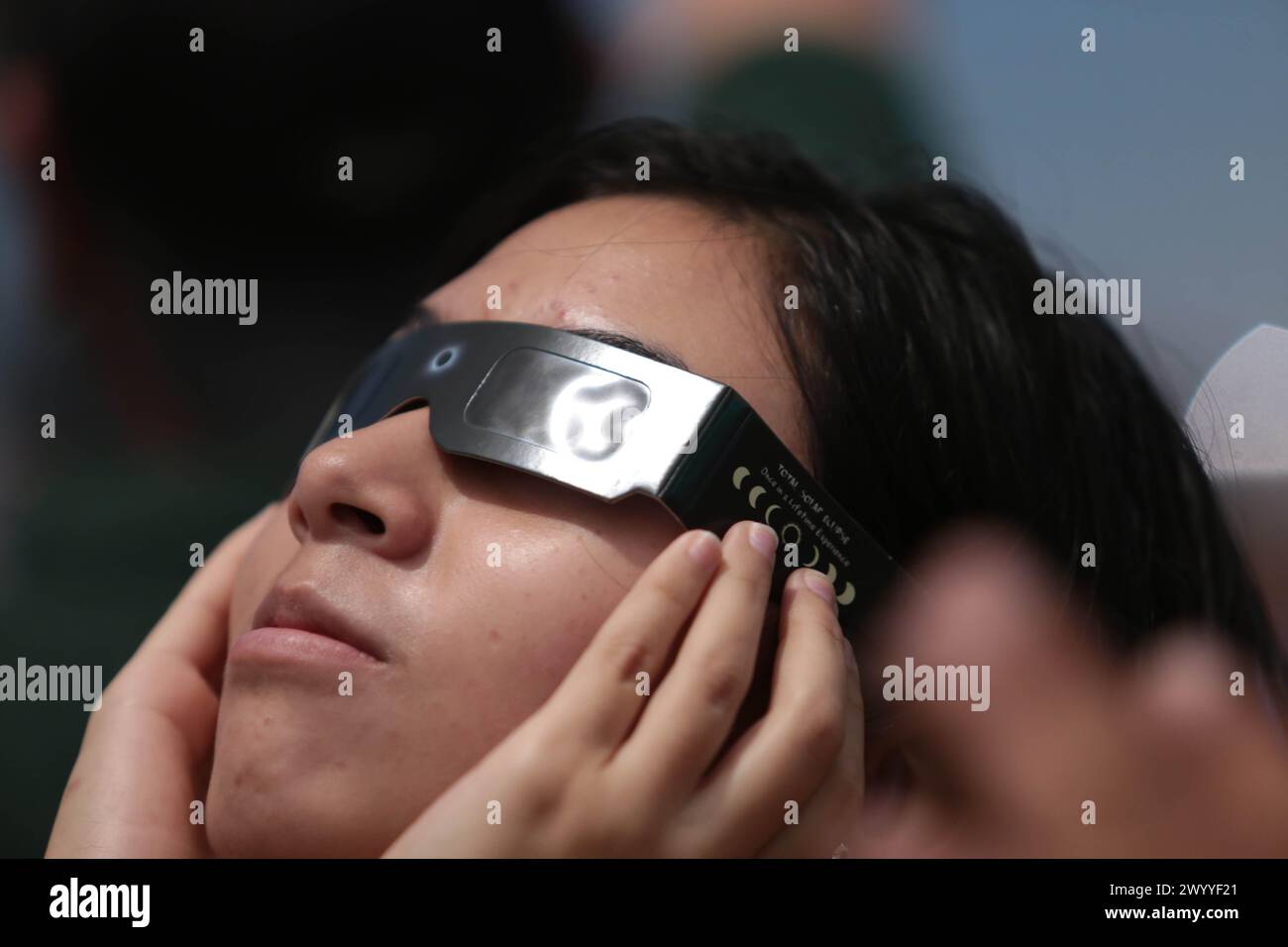 08 April 2024, Mexico, Mazatlán: People watch the total solar eclipse ...
