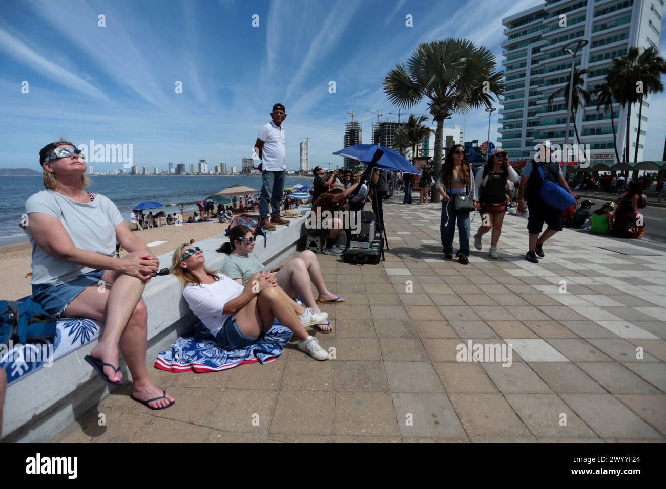 08 April 2024, Mexico, Mazatlán: People watch the total solar eclipse ...