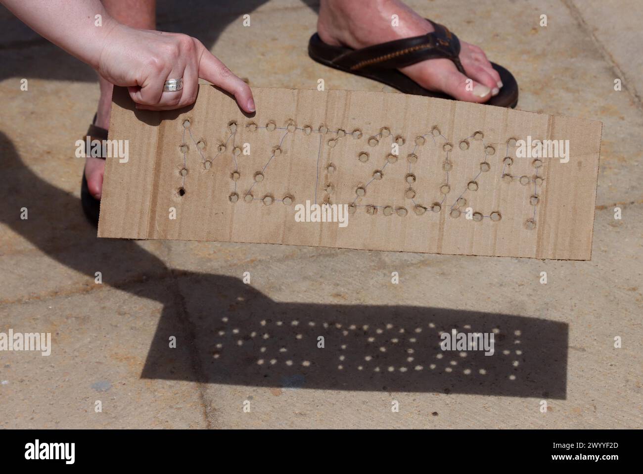 08 April 2024, Mexico, Mazatlán: People watch the total solar eclipse ...