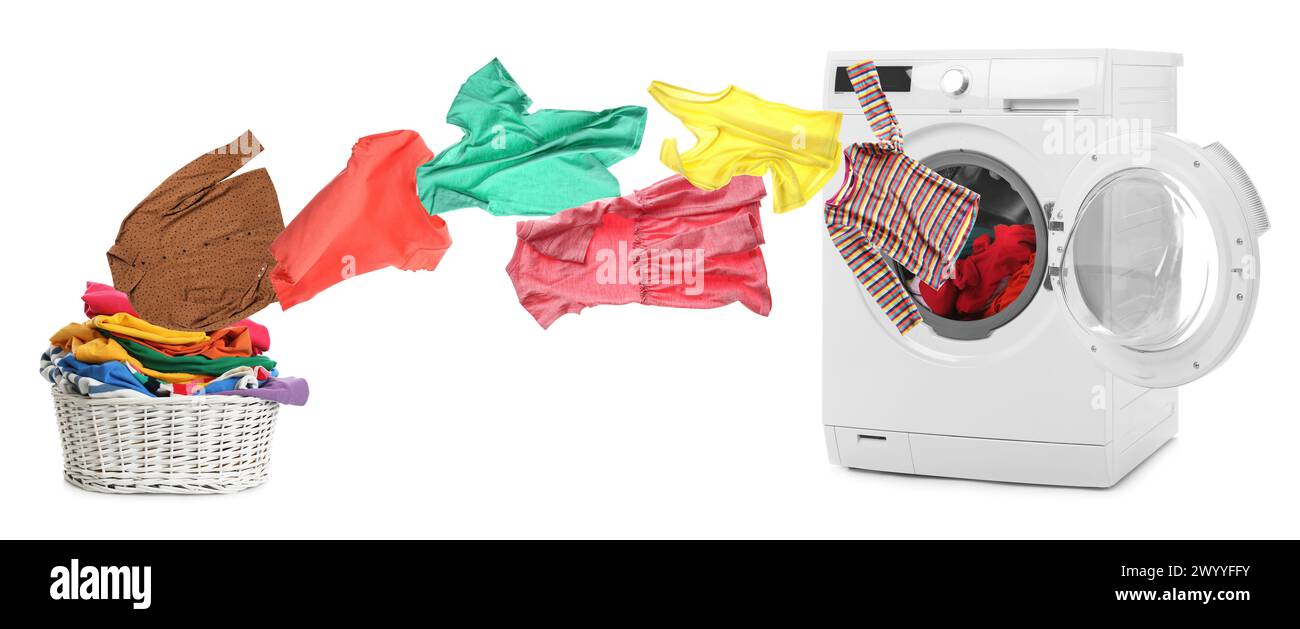 Clothes flying from washing machine into laundry basket on white ...