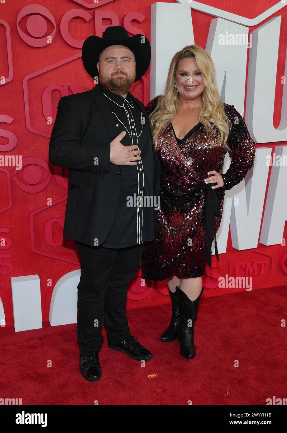 Paul Walter Hauser, Amy Elizabeth Boland attend the 2024 CMT Music ...