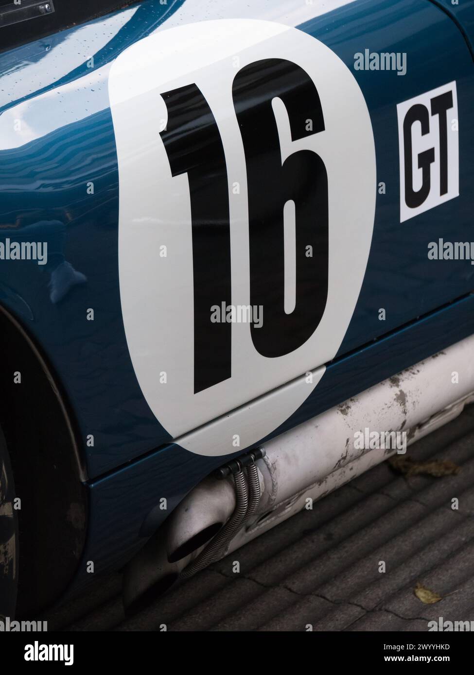 Vintage sportscar with number 16 on the side, participating in a car ...