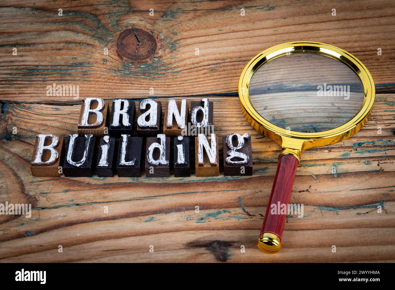 BRAND BUILDING. Alphabet letters on wood texture background Stock Photo ...