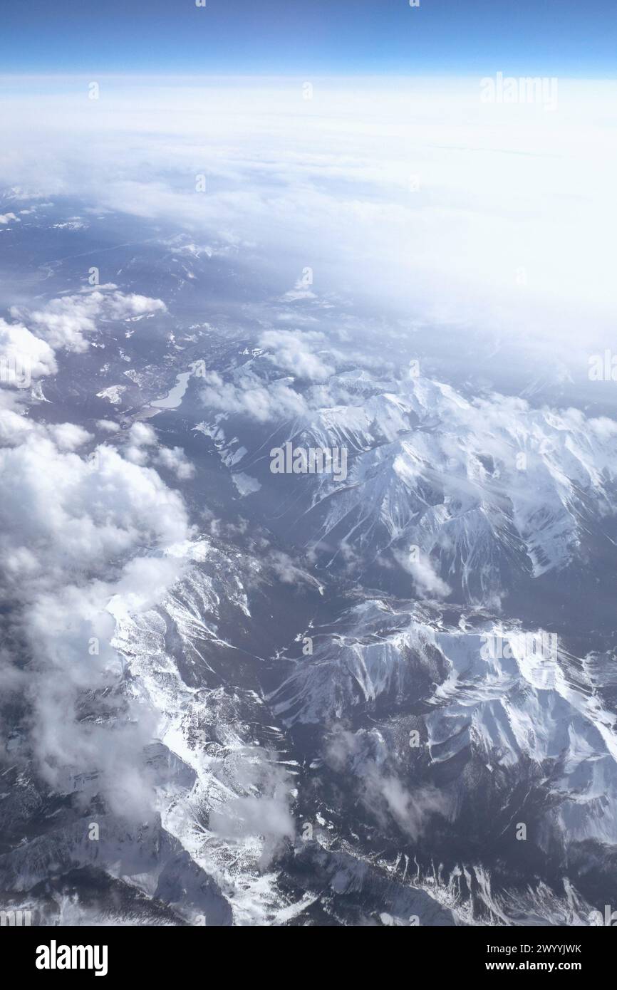 Aerial view of Kootenay region of British Columbia, blue sky, clouds, snowcapped mountains Stock ...