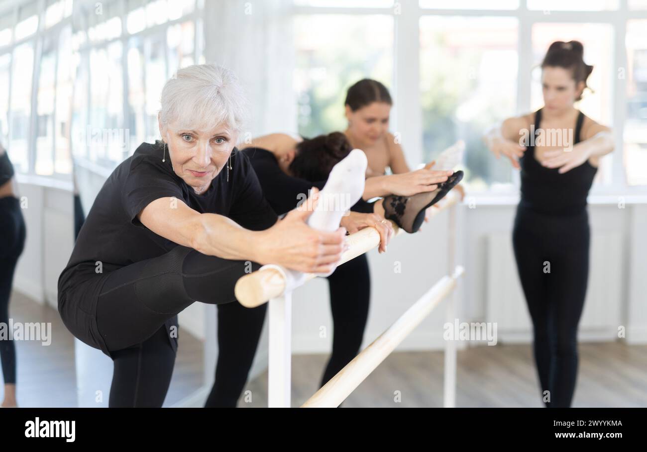Flexible dancer practicing stretching routine hi-res stock photography ...