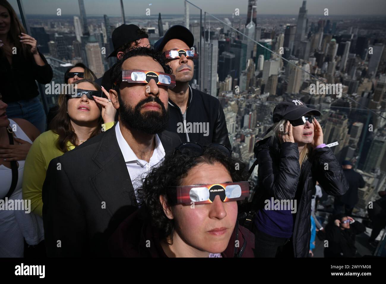 People gather at watch the Solar Eclipse at Edge Hudson Yards on April ...