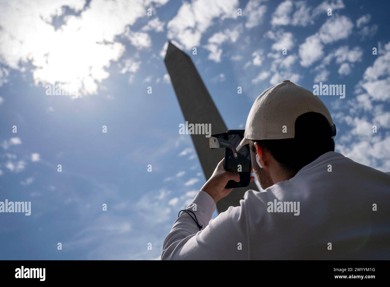 Washington, United States. 08th Apr, 2024. A man takes a picture of the ...