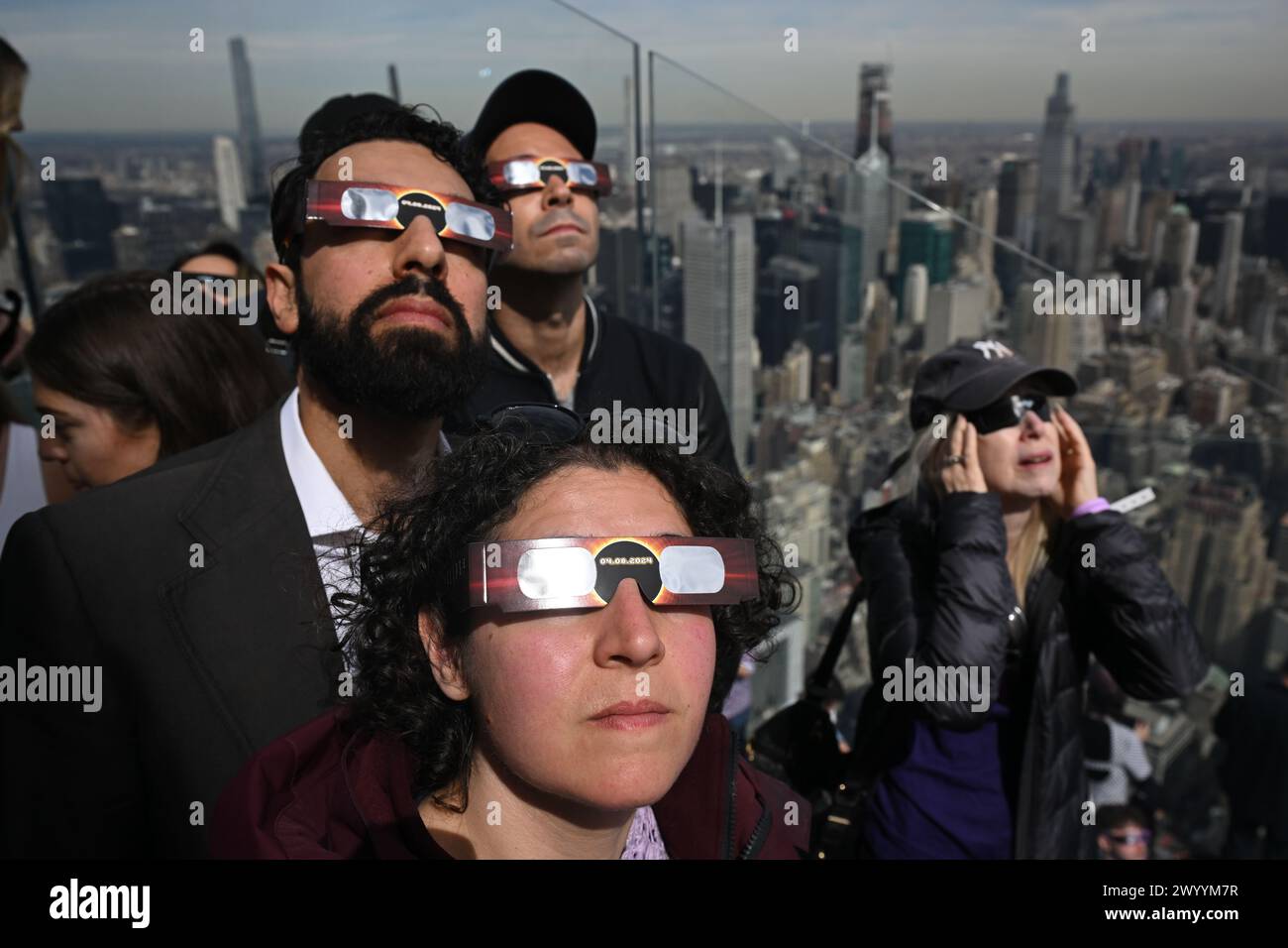 People gather at watch the Solar Eclipse at Edge Hudson Yards on April ...