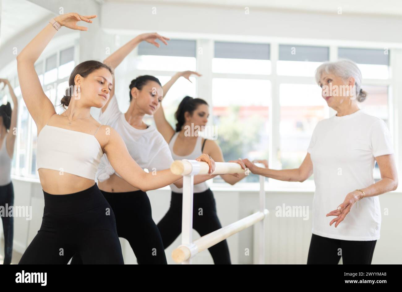 Woman practicing demi plie hi-res stock photography and images - Alamy