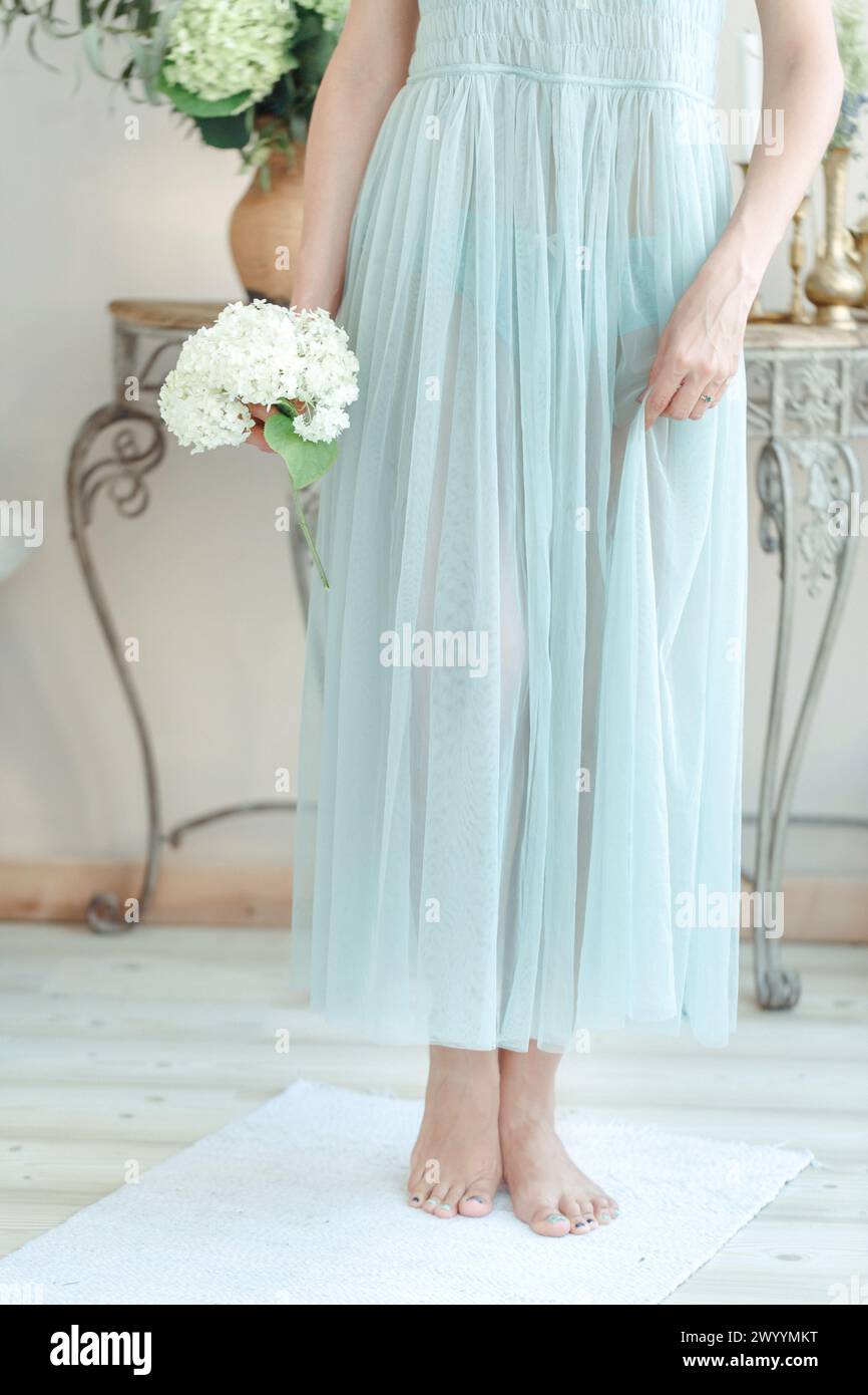 Woman wearing dress covering hi-res stock photography and images - Alamy