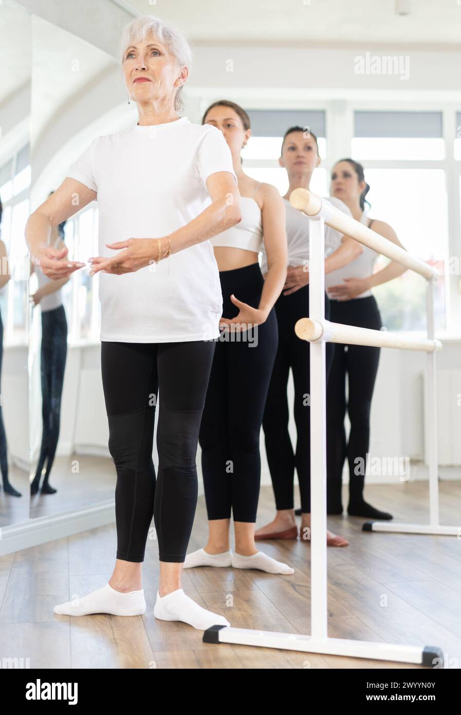 Girls in ballet class perform first position with participation of ...