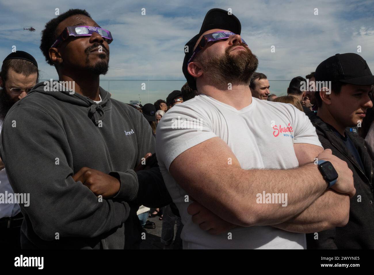 New York, USA. 08th Apr, 2024. People watch the partial solar eclipse ...