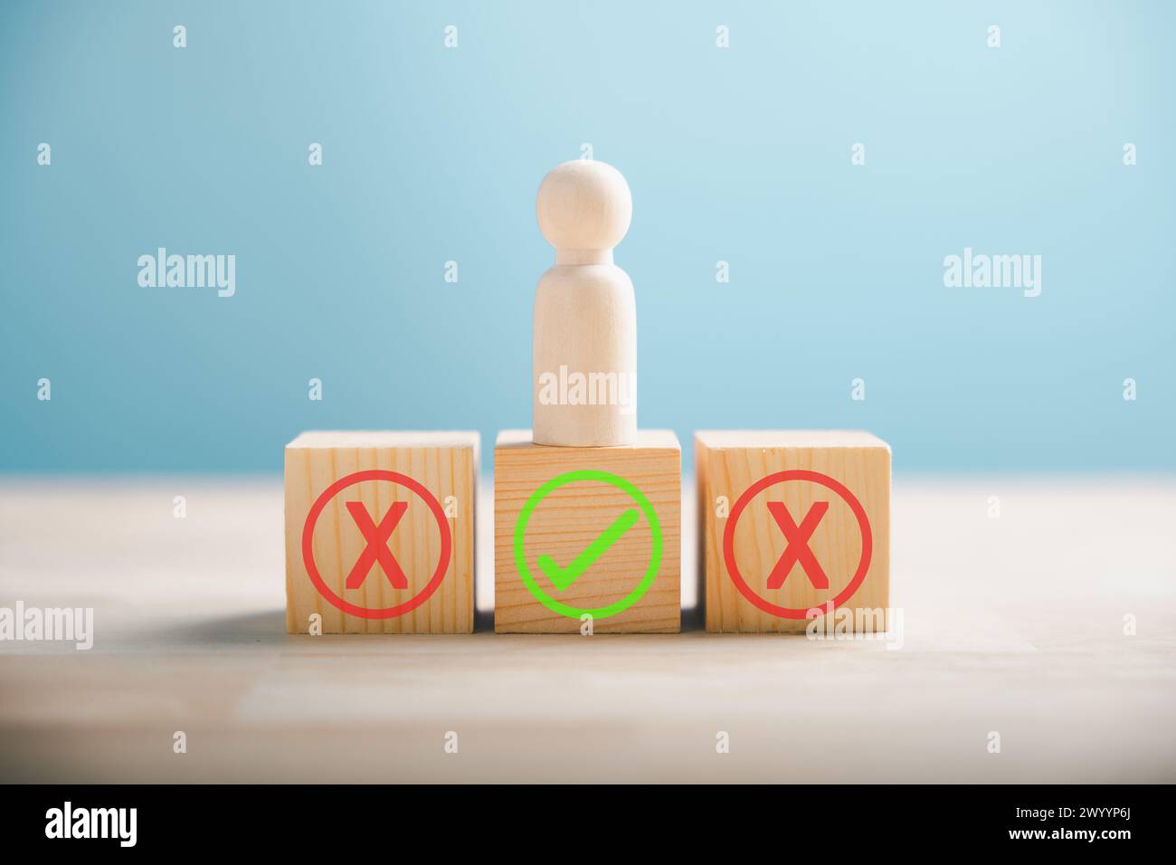 Wooden cube block displays people examining right and wrong considering ...