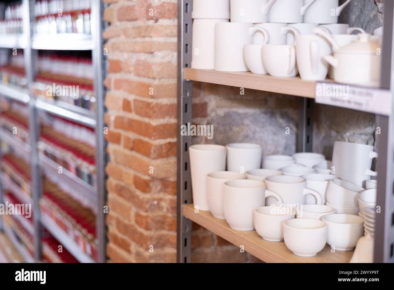 Pottery stands on wooden rack in pottery shop Stock Photo - Alamy