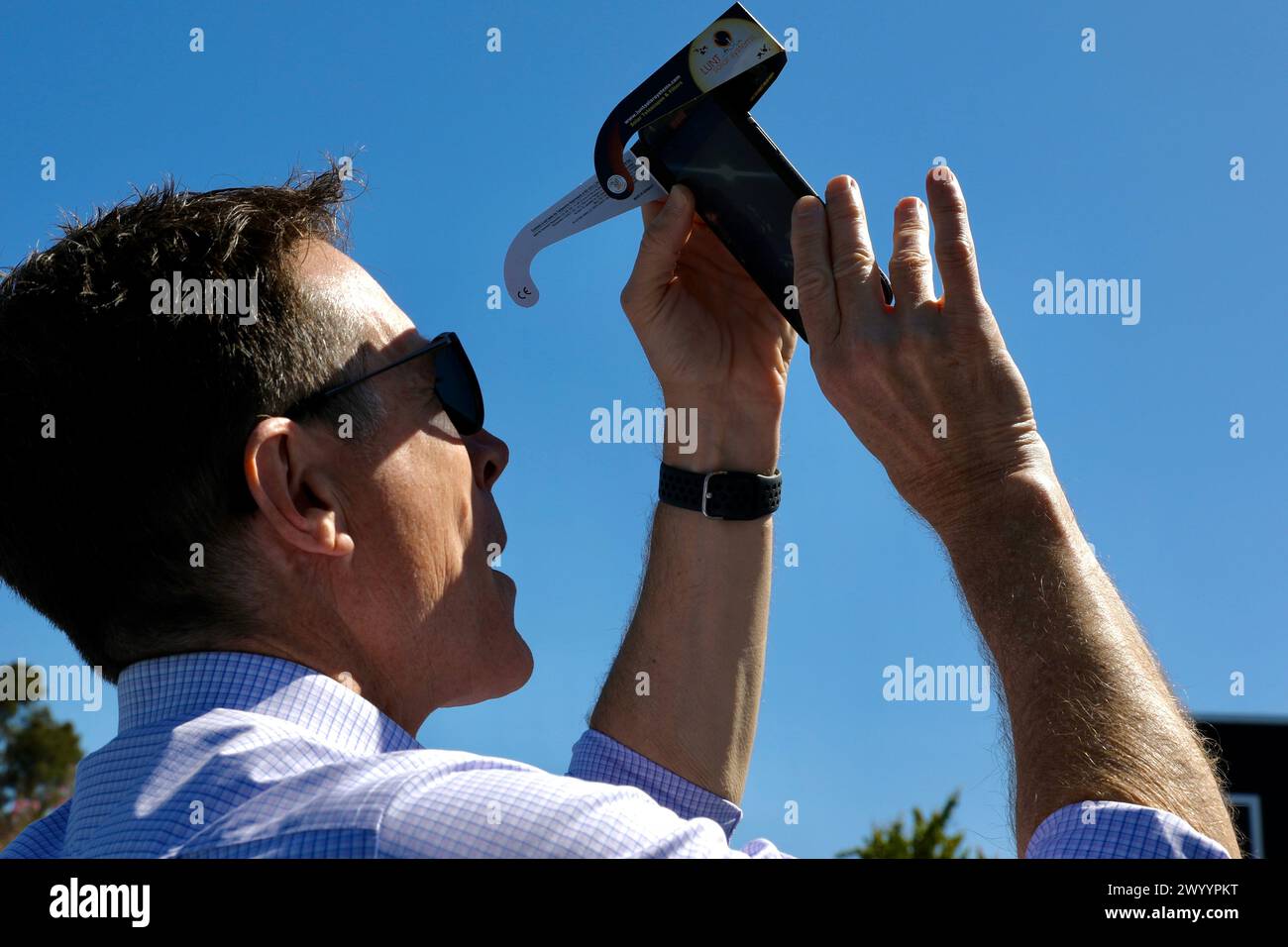 Los Angeles, USA. 8th Apr, 2024. A man watches a solar eclipse with ...