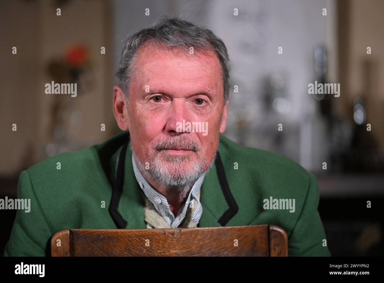 Munich, Germany. 08th Apr, 2024. The actor Hansi Kraus sits on a chair ...