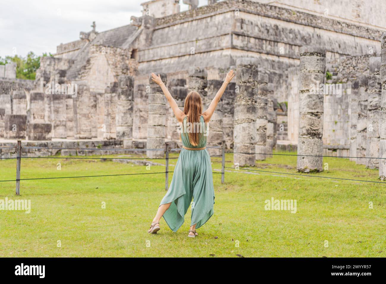 Beautiful tourist woman observing the old pyramid and temple of the ...
