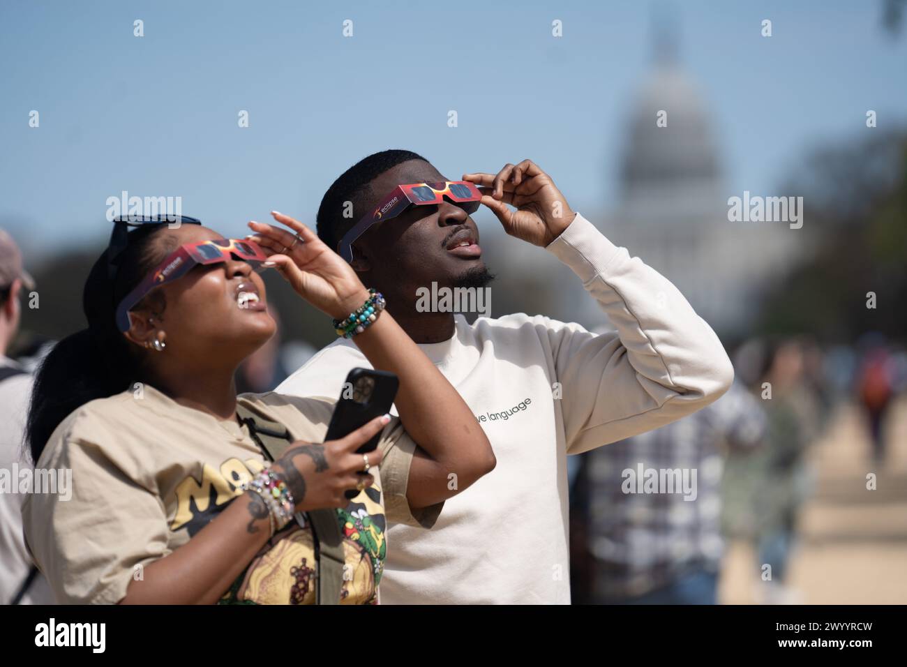 Washington, USA. 8th Apr, 2024. People observe a solar eclipse in ...