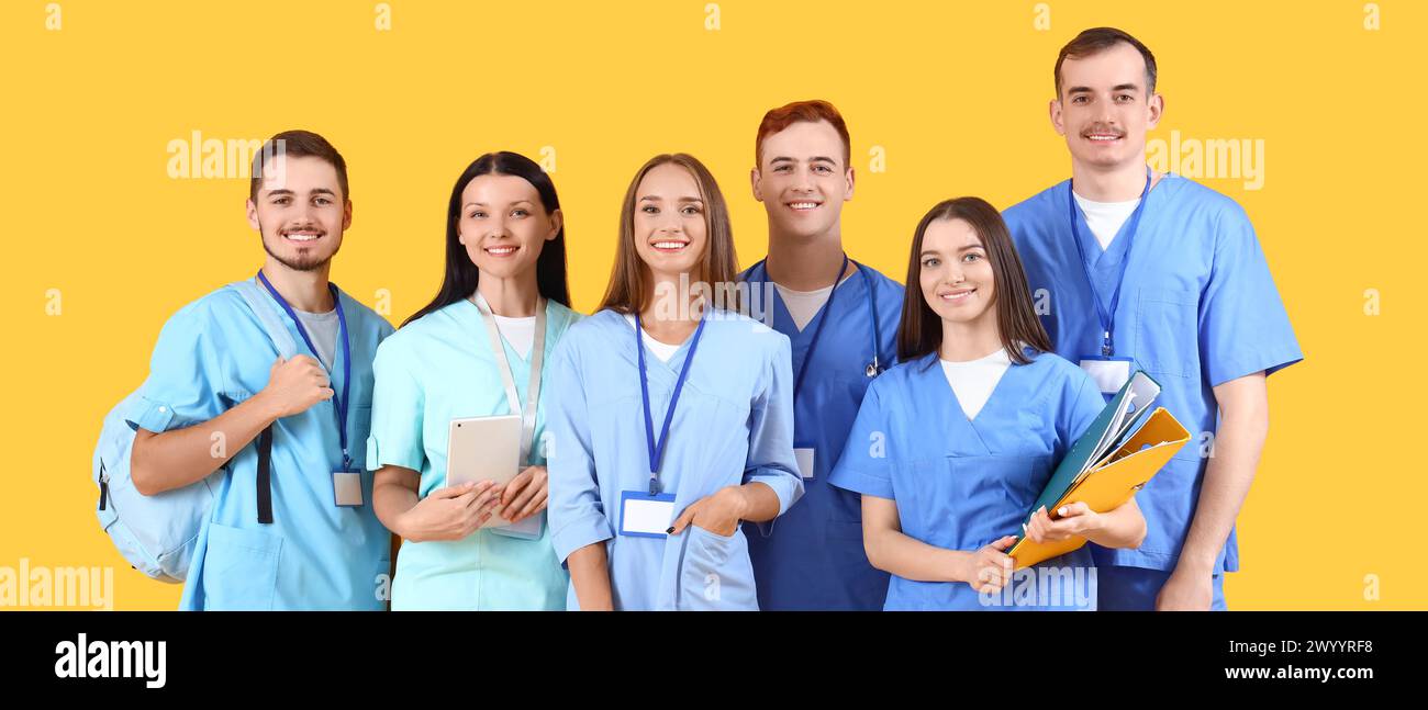 Group of medical students on yellow background Stock Photo - Alamy