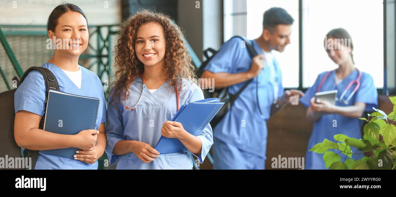 Female medical student in corridor of modern clinic Stock Photo - Alamy