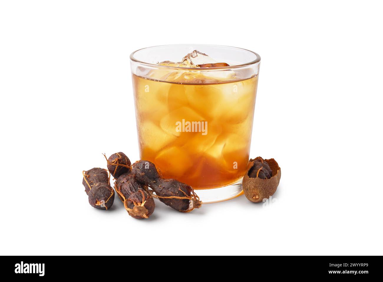 Glass of tasty tamarind drink and fruits on white background Stock ...