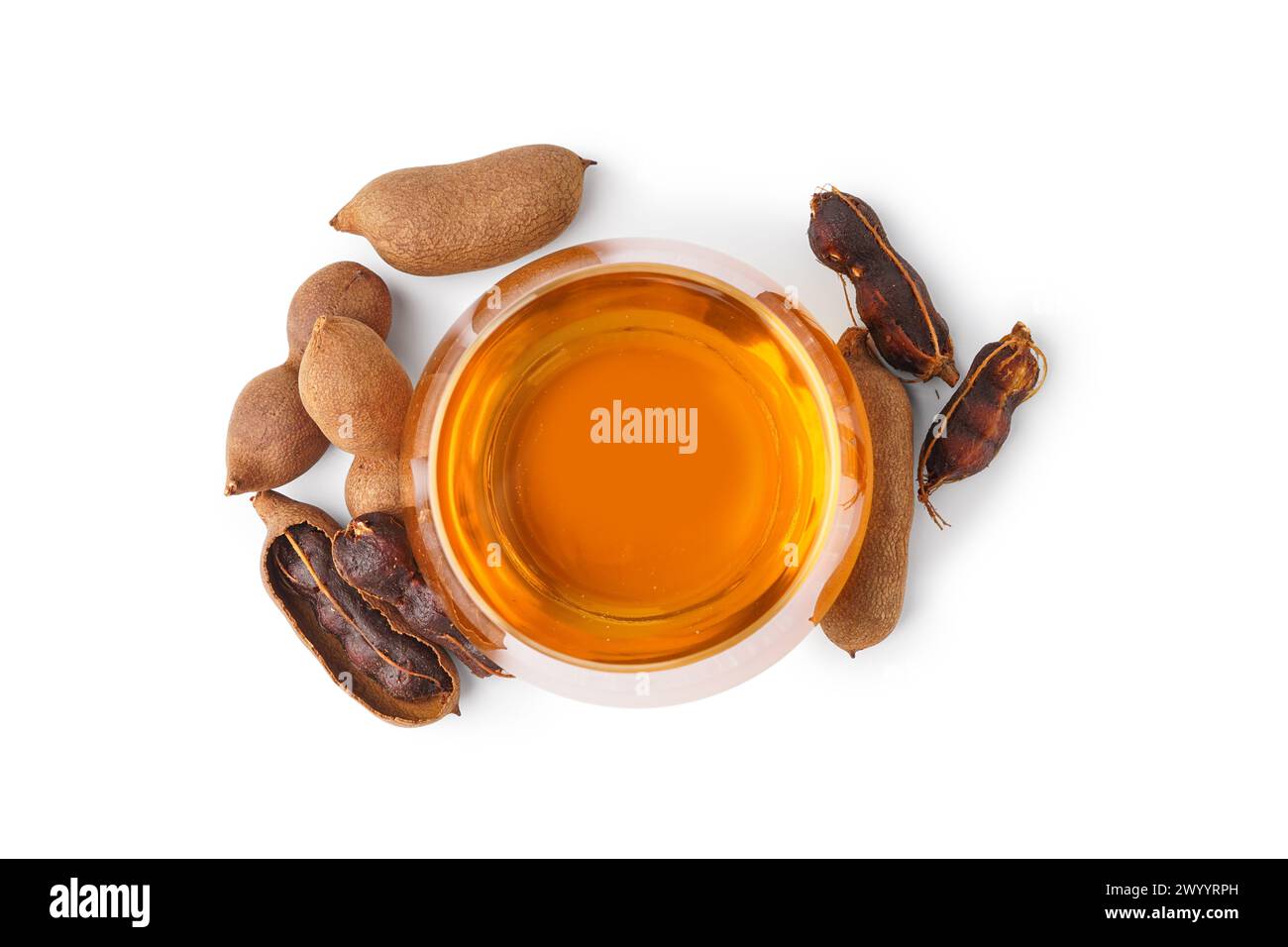Glass of tasty tamarind drink and fruits on white background Stock ...